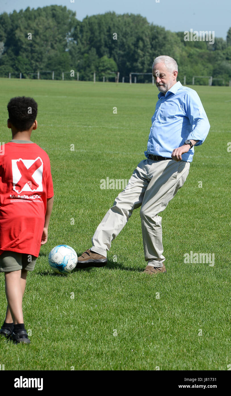 Labour Party leader Jeremy Corbyn plays football with children during a ...