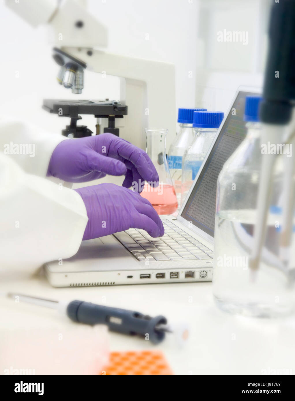 Laptop technology gloved hand hi-res stock photography and images - Alamy