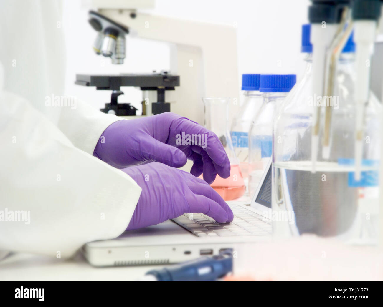Laptop technology gloved hand hi-res stock photography and images - Alamy