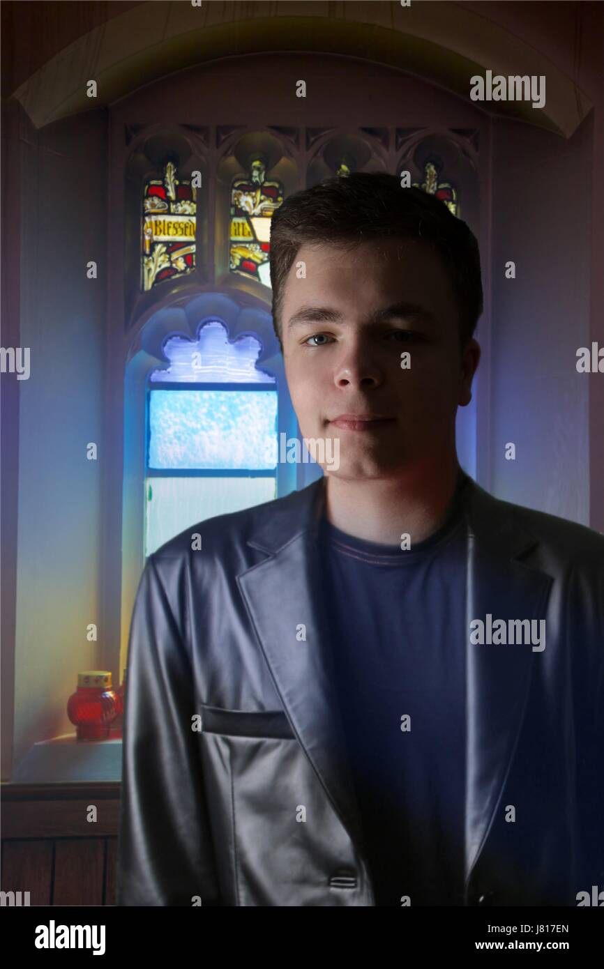 A young guy looking at camera Stock Photo - Alamy
