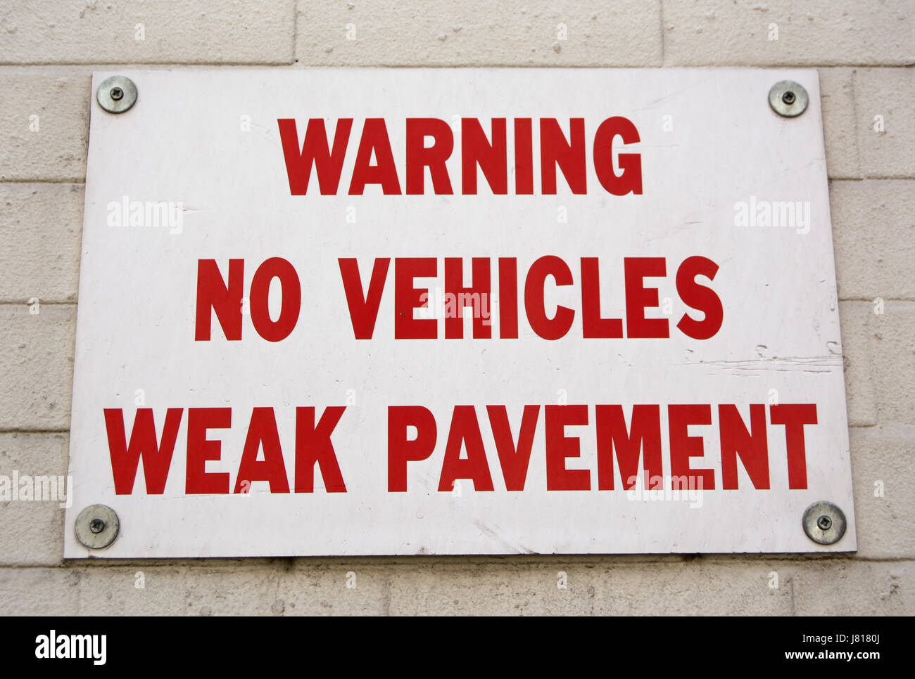 warning sign stating no vehicles weak pavement, in durham house street ...