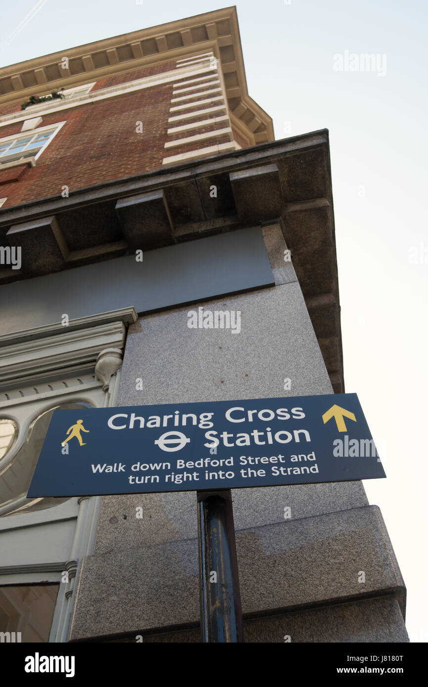wayfaring sign giving directions to charing cross station, in covent ...