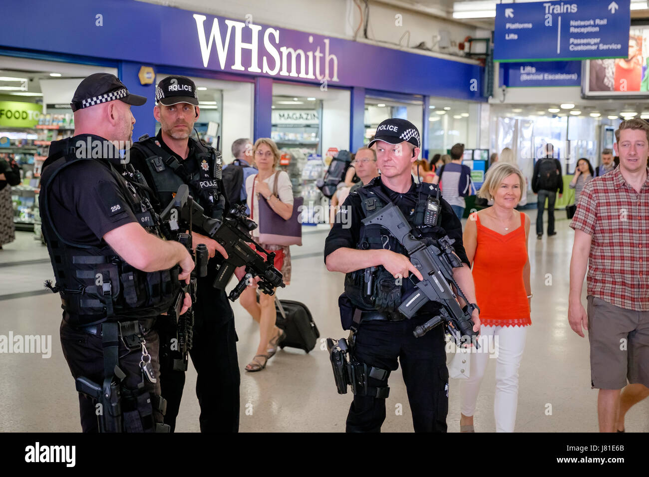 Armed Police patrol Leeds City Railway Station. West Yorkshire. UK. 26 ...