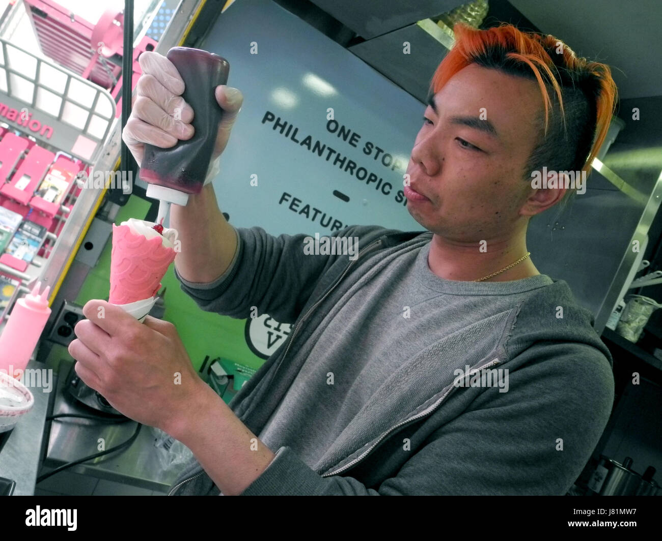 New York, US. 24th May, 2017. Ken Lo, employee of the ice cream parlor ...