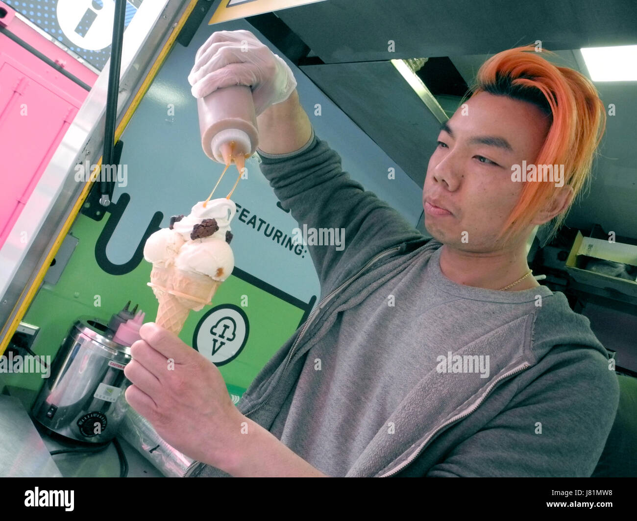New York, US. 24th May, 2017. Ken Lo, employee of the ice cream parlor ...