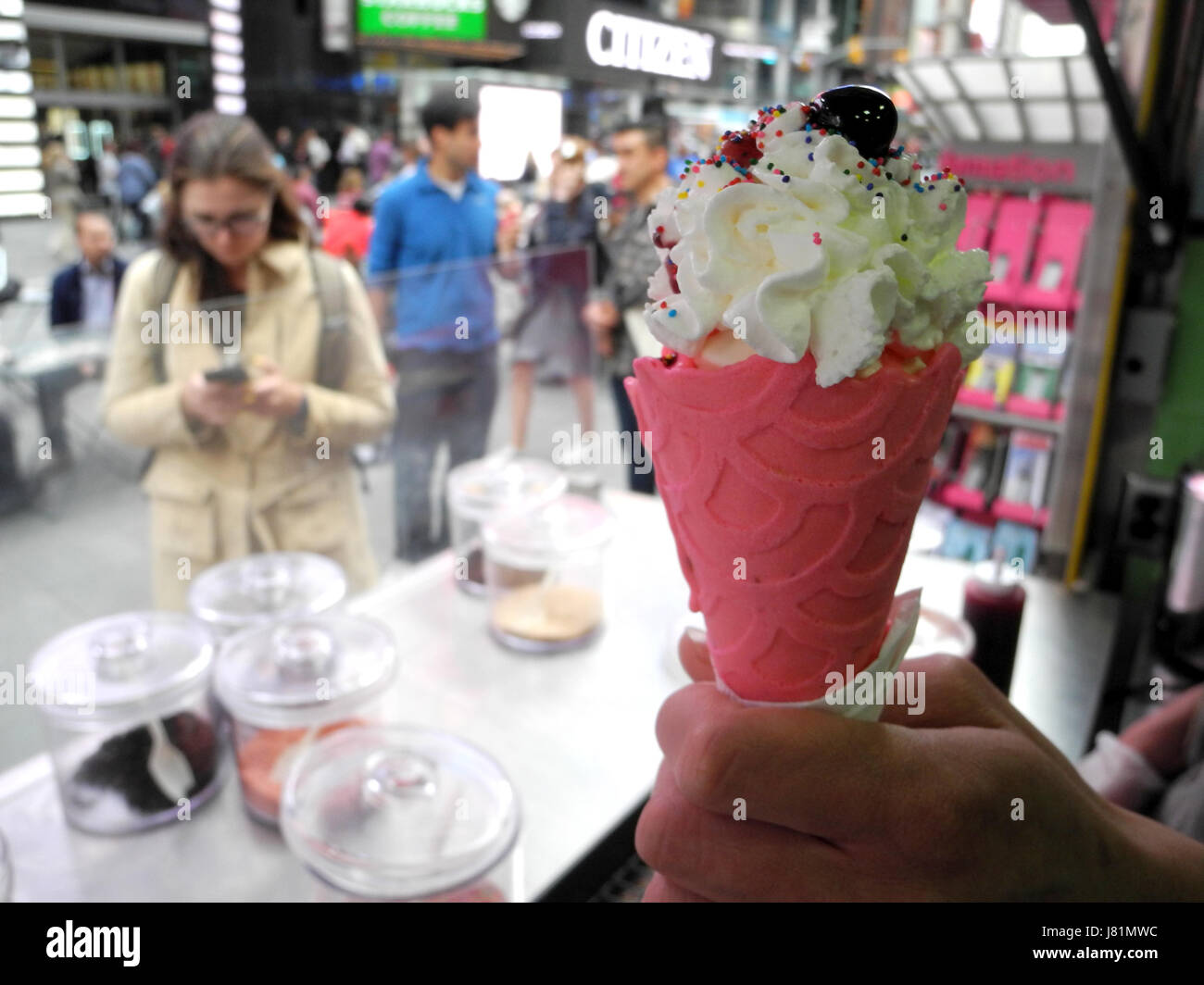 New York, US. 24th May, 2017. Ken Lo, employee of the ice cream parlor ...