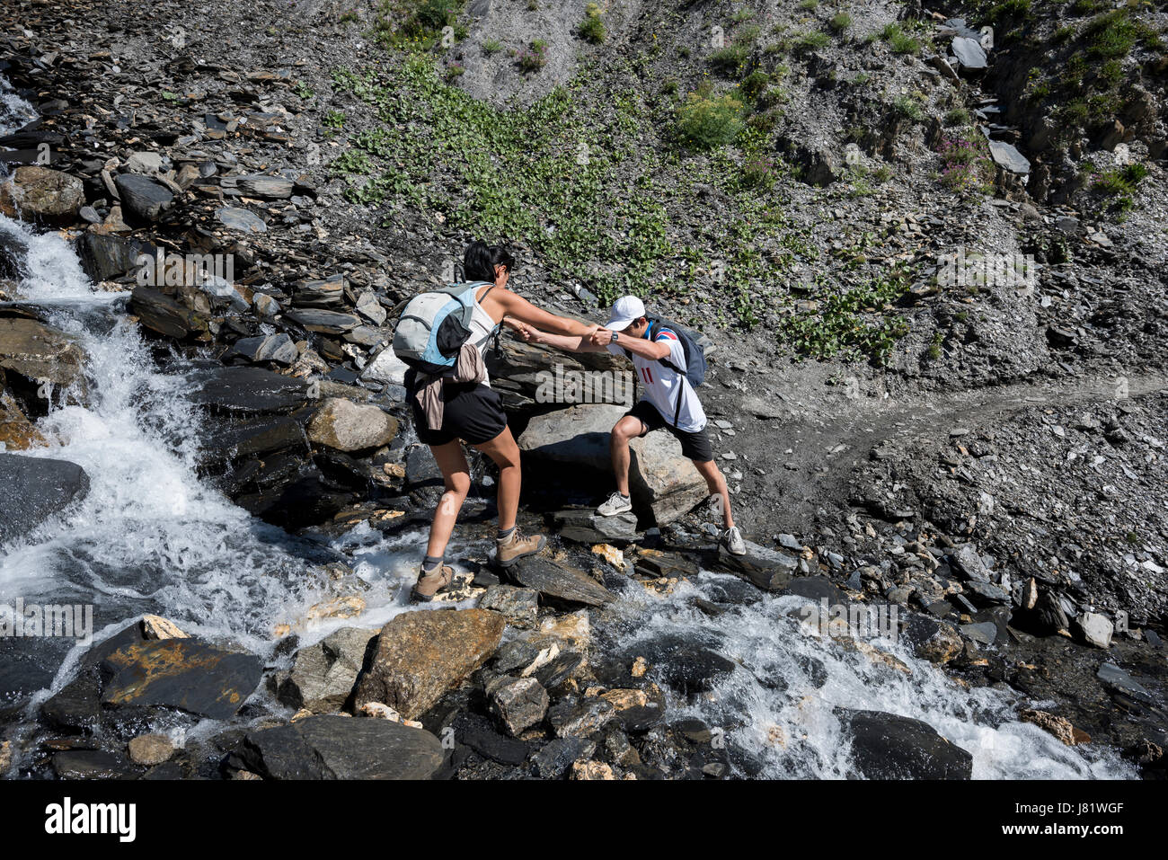 Boy woman crossing help hi-res stock photography and images - Alamy