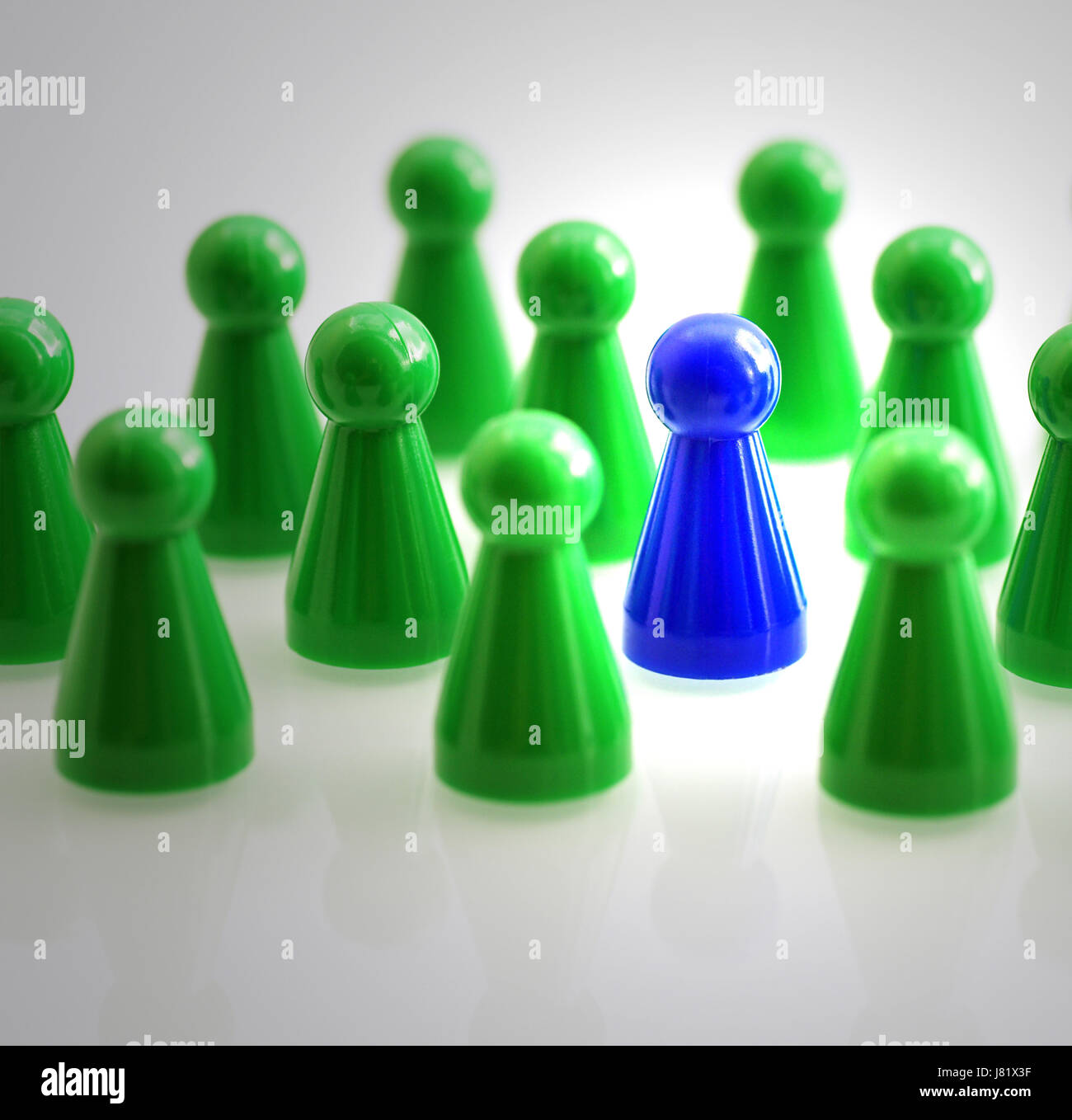 blue team leader in the spotlight - business concept Stock Photo - Alamy