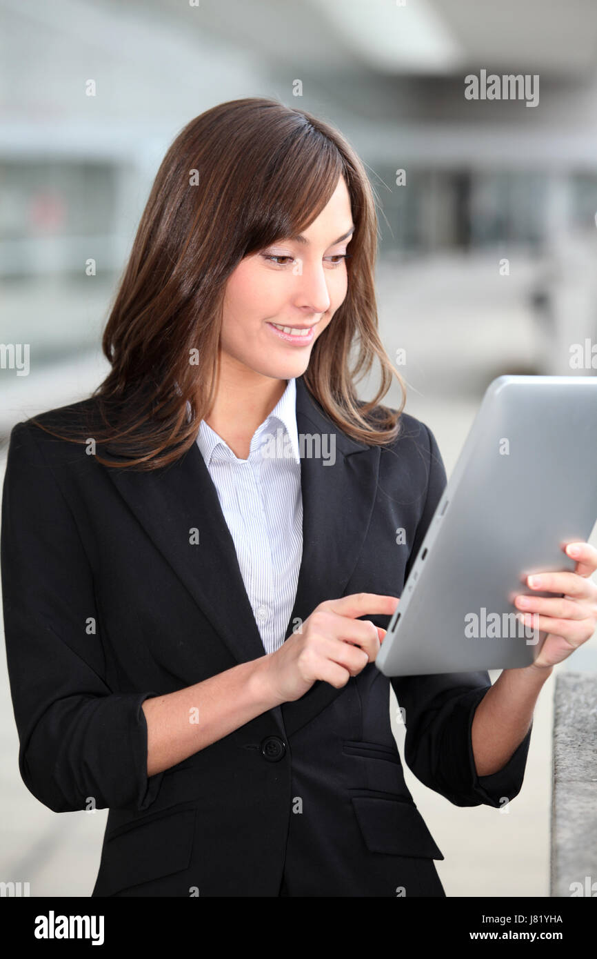 woman newspaper journal office laptop notebook computers computer laugh ...