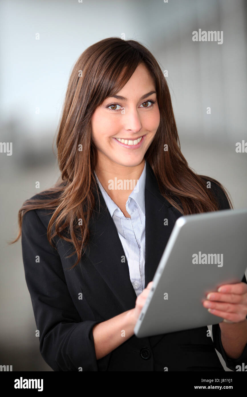 woman newspaper journal office laptop notebook computers computer laugh ...