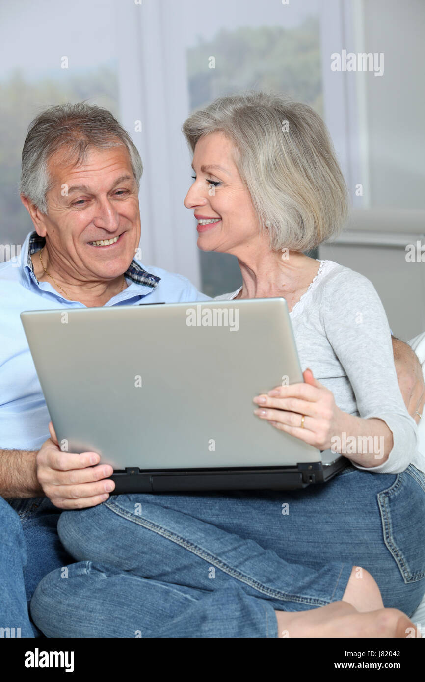 woman house building laptop notebook computers computer laugh laughs ...