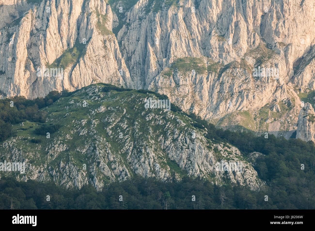 Early morning sunbeam on mountain cliff Stock Photo - Alamy