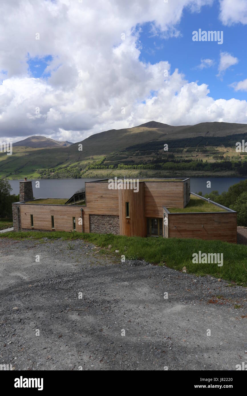 Exterior of new build wood clad house by Loch Tay Scotland May 2017 ...