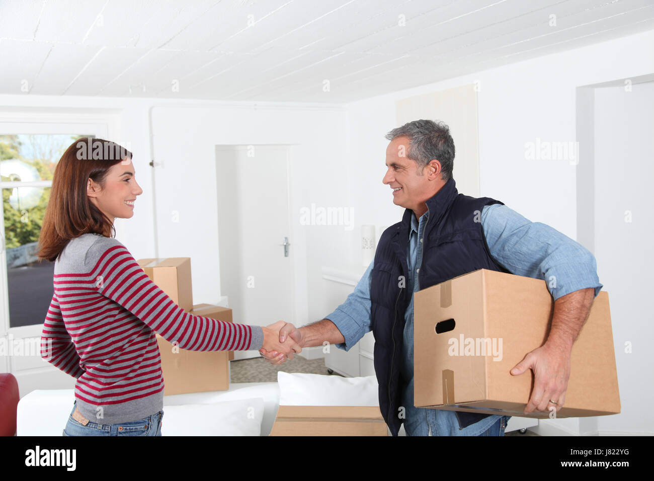 woman motion postponement moving movement house building men man hand ...