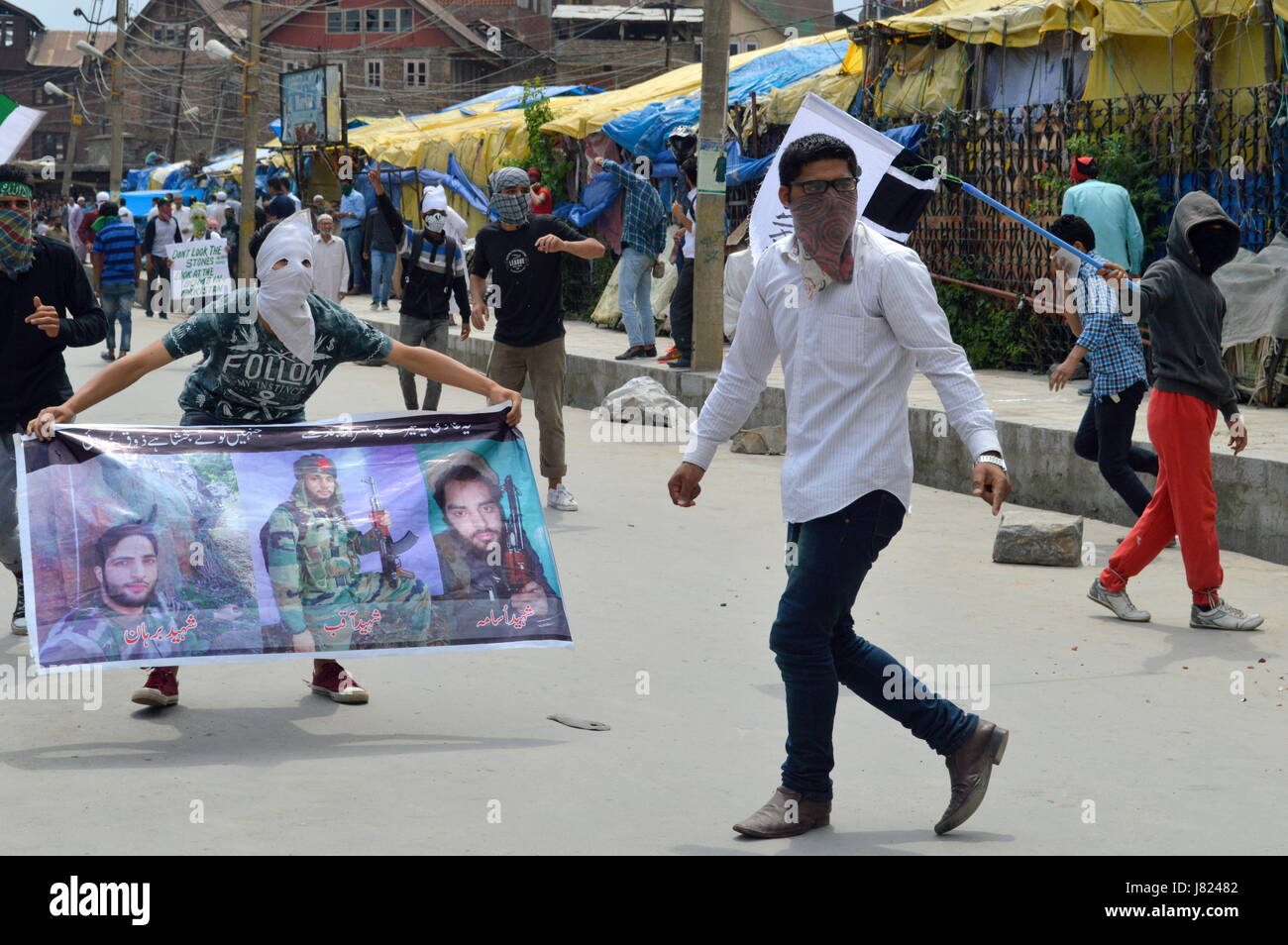 Srinagar, Kashmir. 26th May, 2017. A group of masked Kashmiri ...