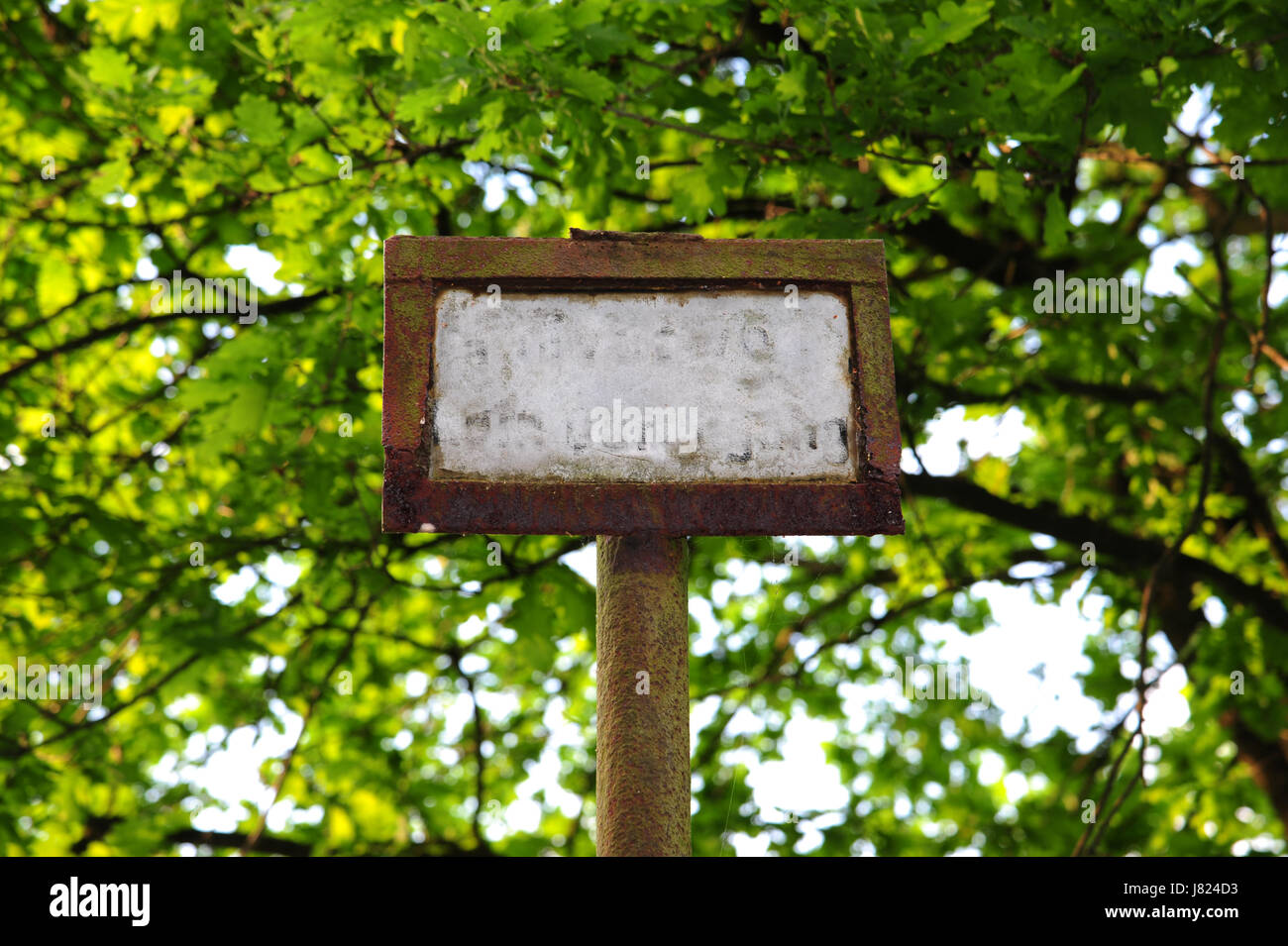 sign signal rust pole weatherworn text deteriorate empty old object ...