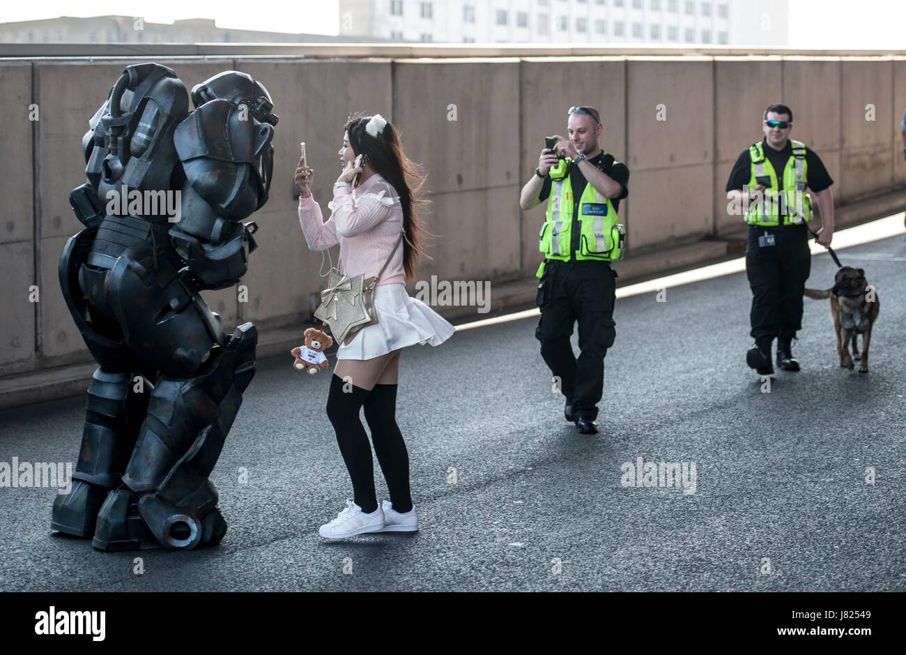 EDITORIAL USE ONLY Security and members of the public photograph a ...