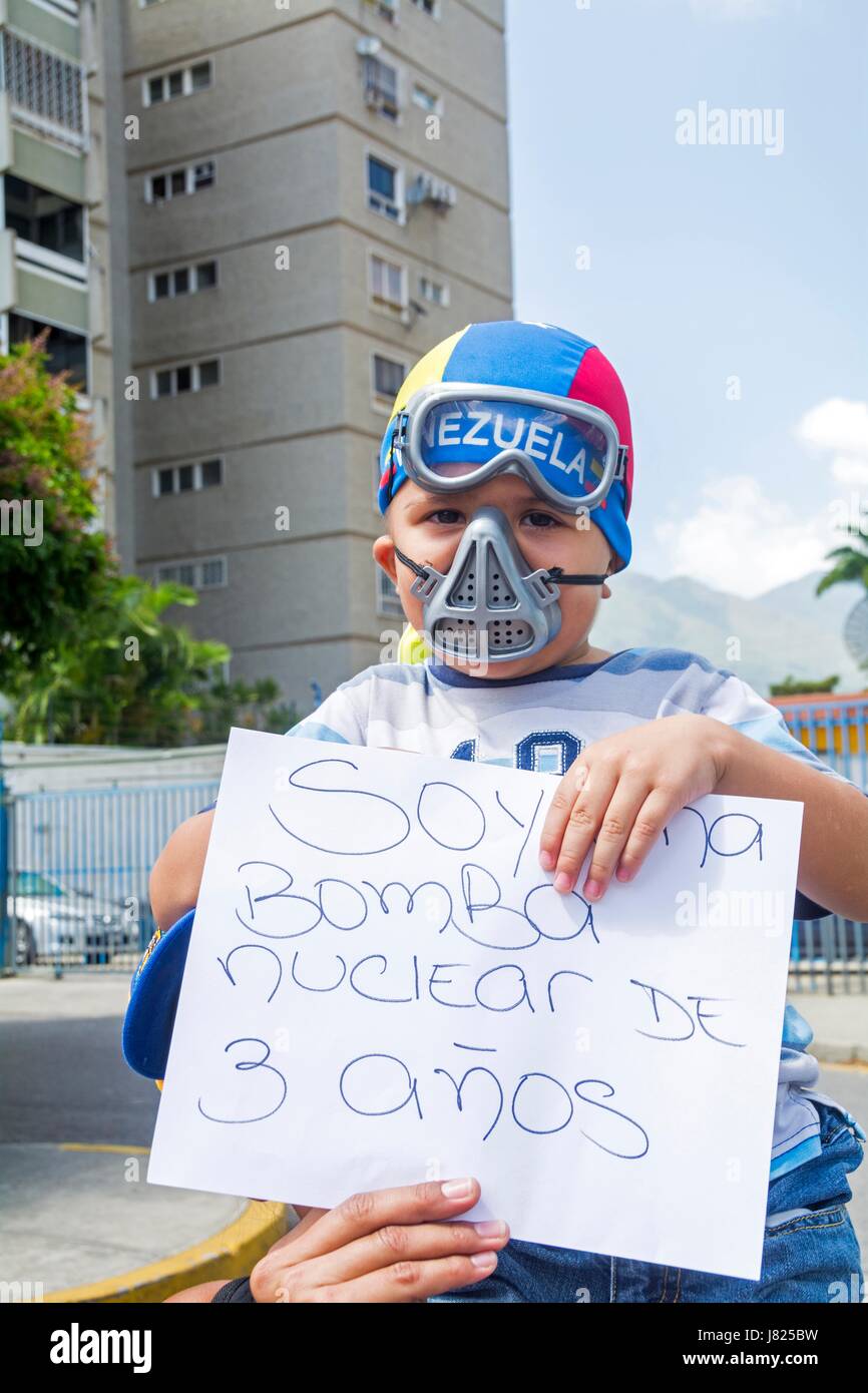 A 3 year old baby shows a sign that says: I am a 3 year old nuclear ...