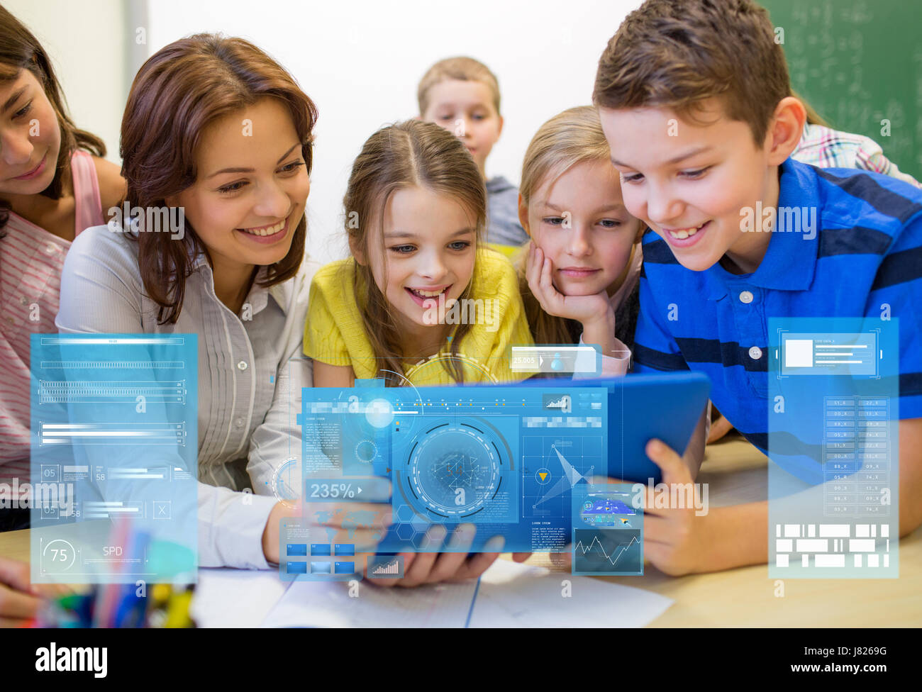 group of kids with teacher and tablet pc at school Stock Photo - Alamy
