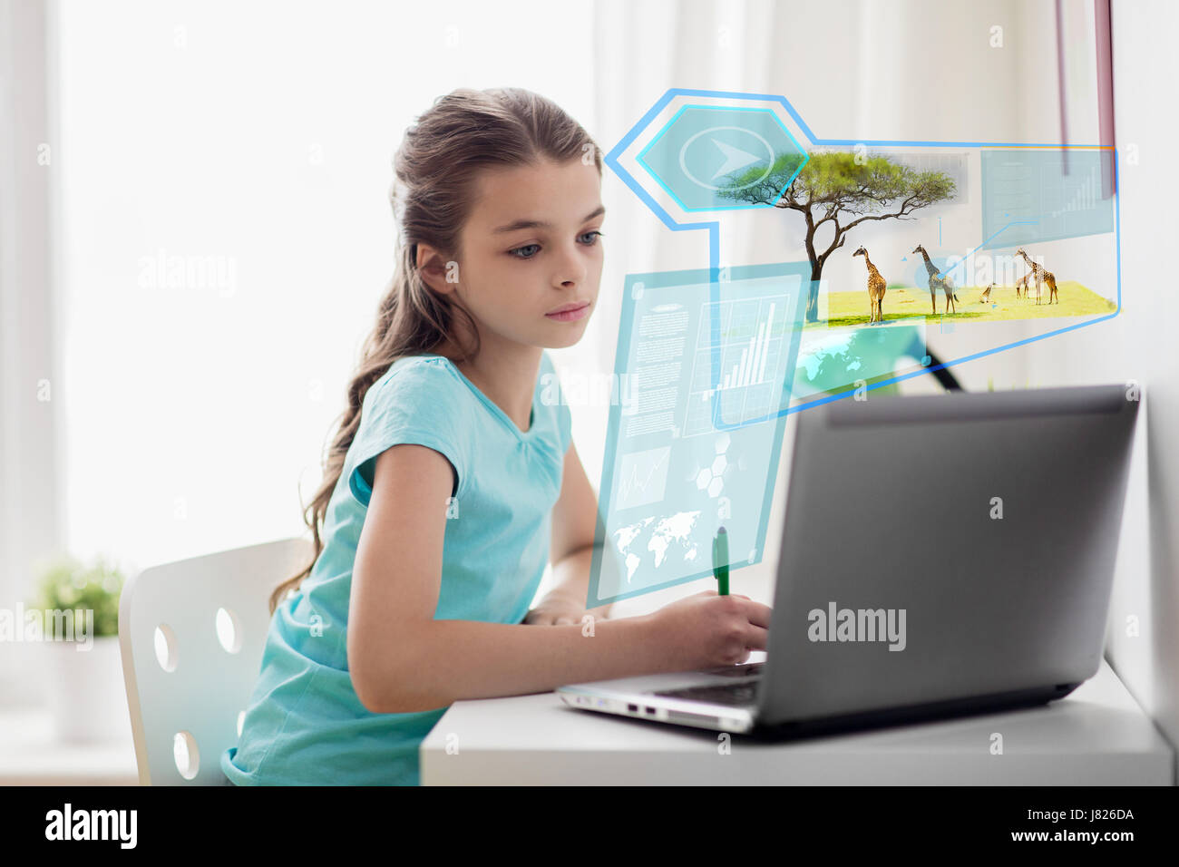 girl with laptop writing to notebook at home Stock Photo - Alamy