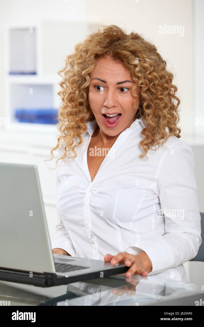 woman office laptop notebook computers computer laugh laughs laughing ...