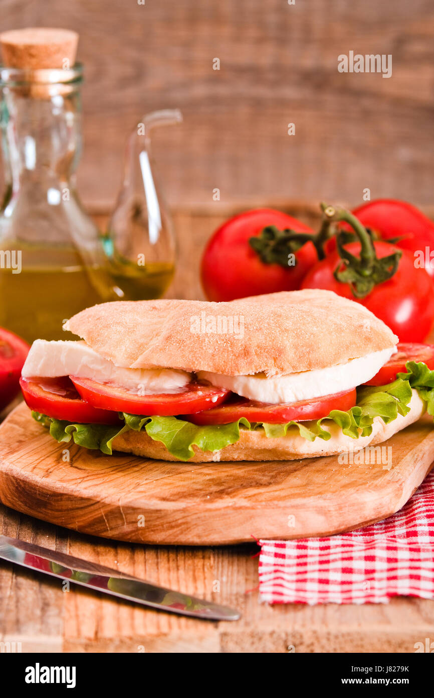 Puccia bread with mozzarella and tomato Stock Photo - Alamy