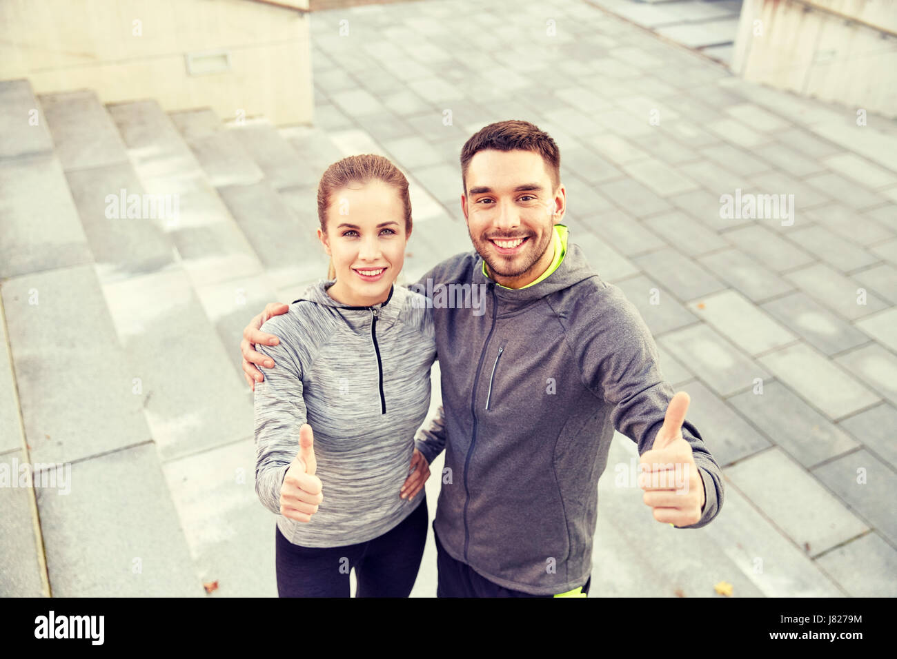 Fit couple showing thumbs up hi-res stock photography and images - Alamy