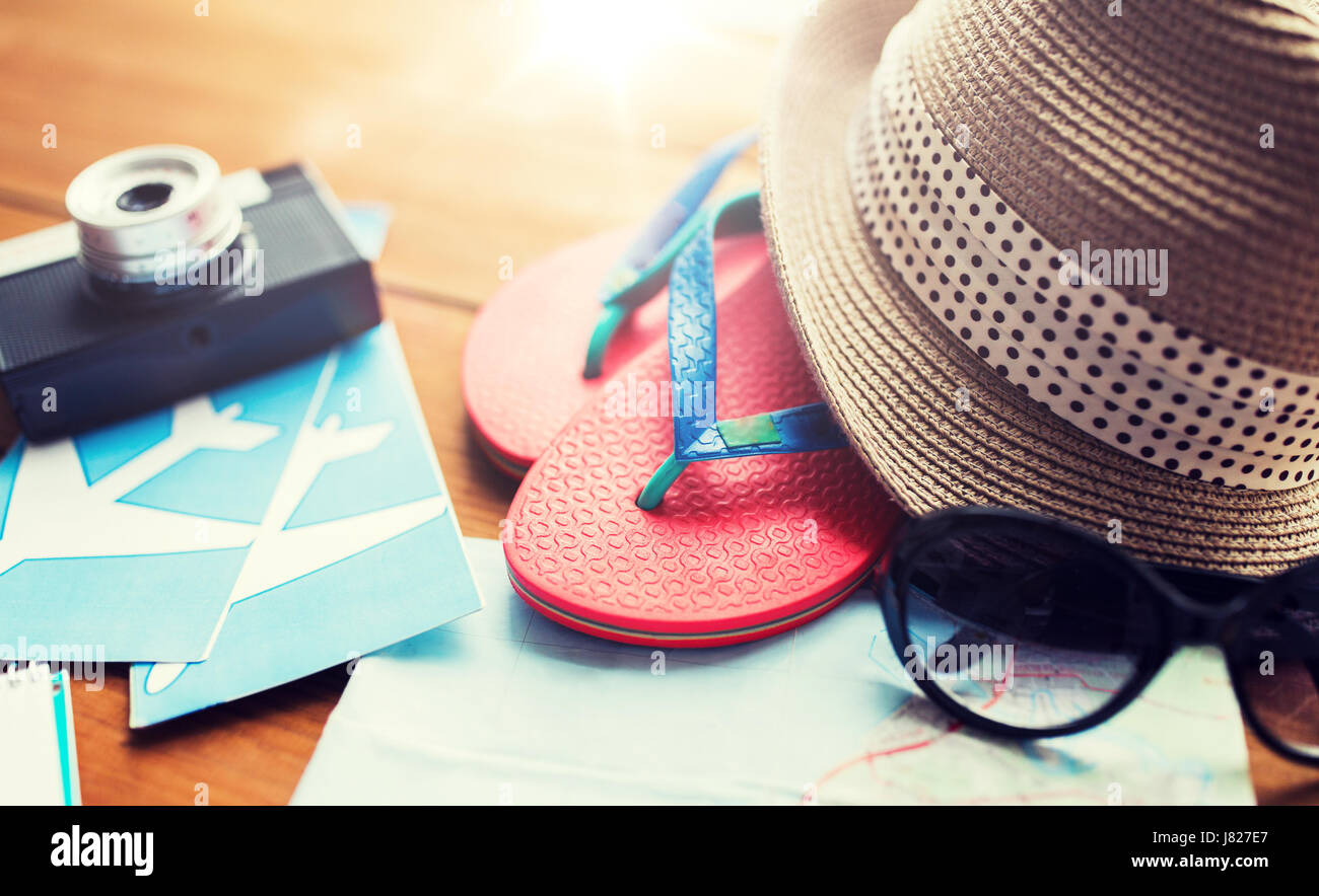 close up of travel map, flip-flops, hat and camera Stock Photo - Alamy