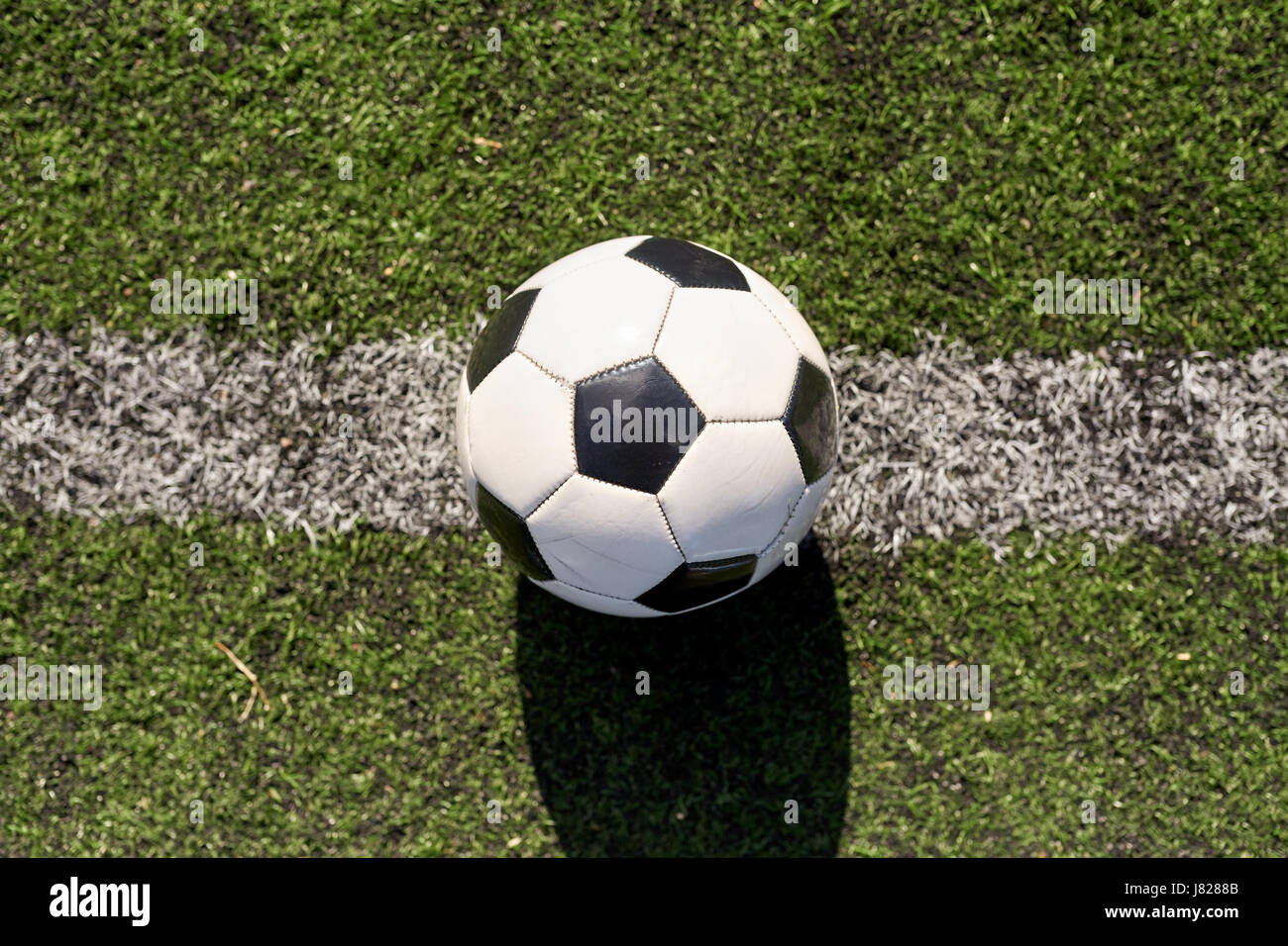 soccer ball on football field marking line Stock Photo - Alamy