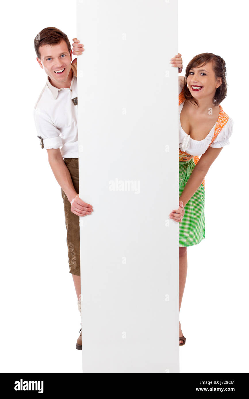 man and woman stand smiling behind advertising space Stock Photo - Alamy