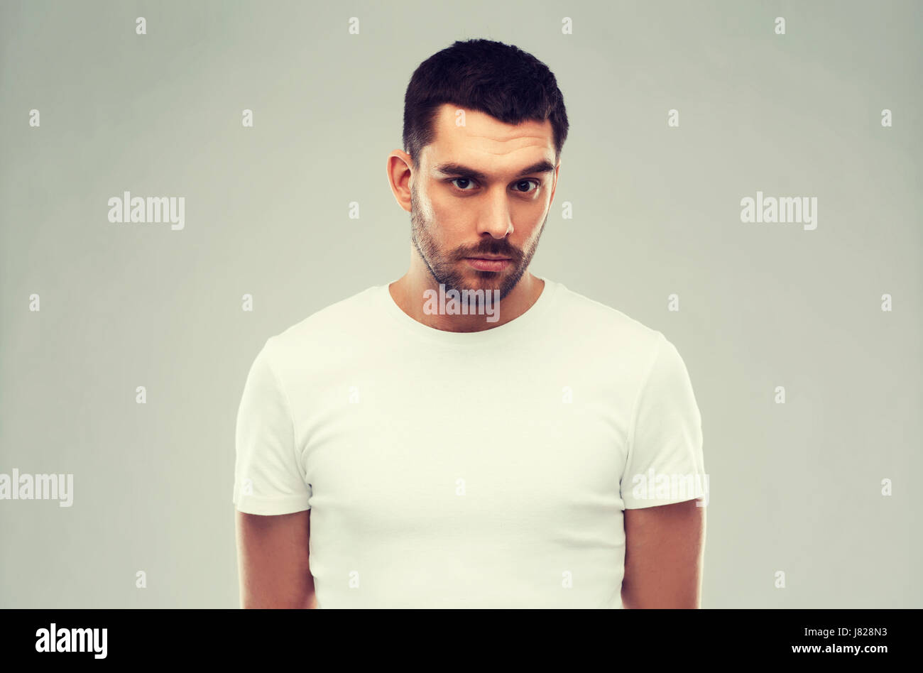 young man portrait over gray background Stock Photo - Alamy