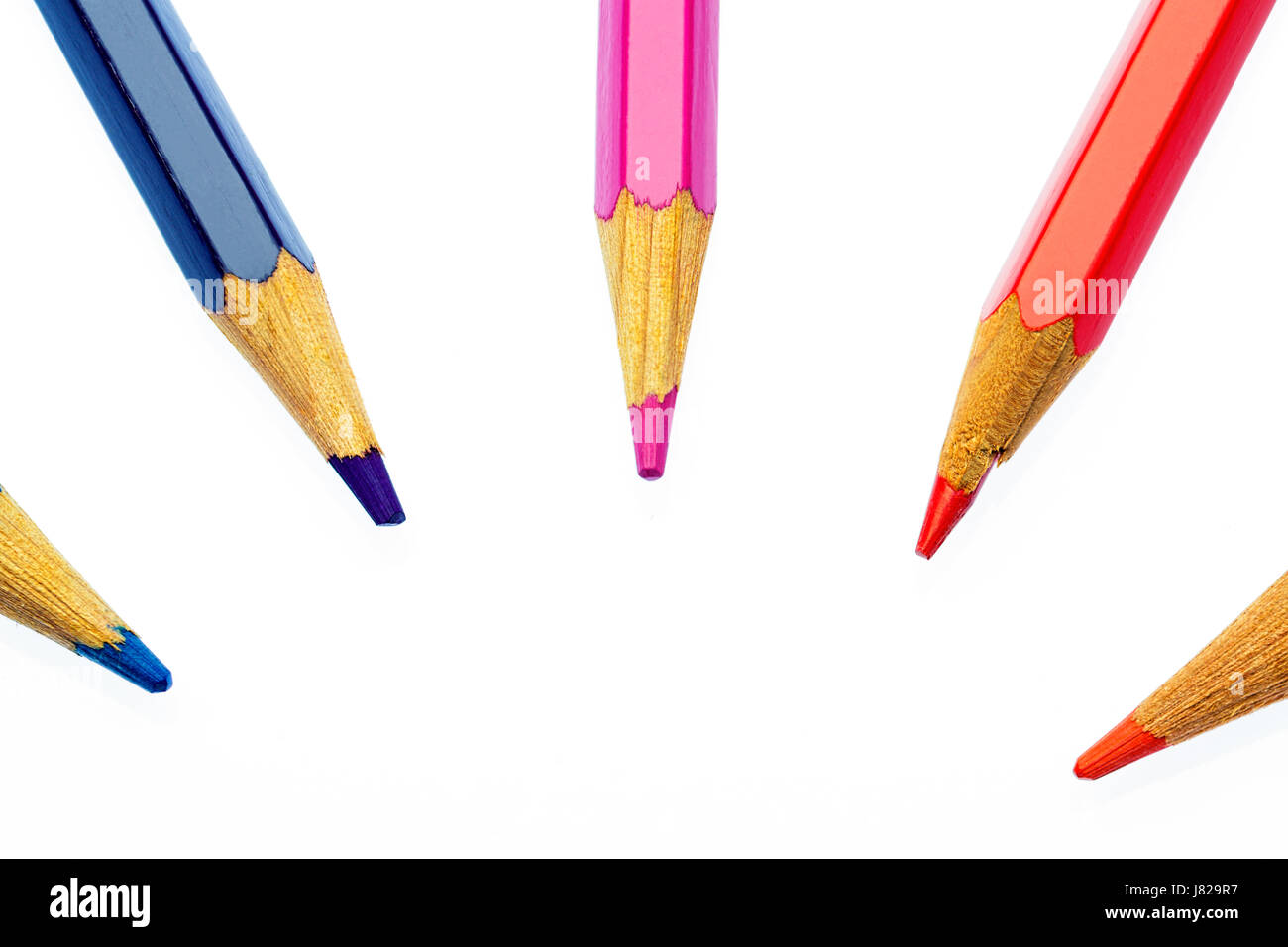 color pencils of different colors on white background Stock Photo - Alamy