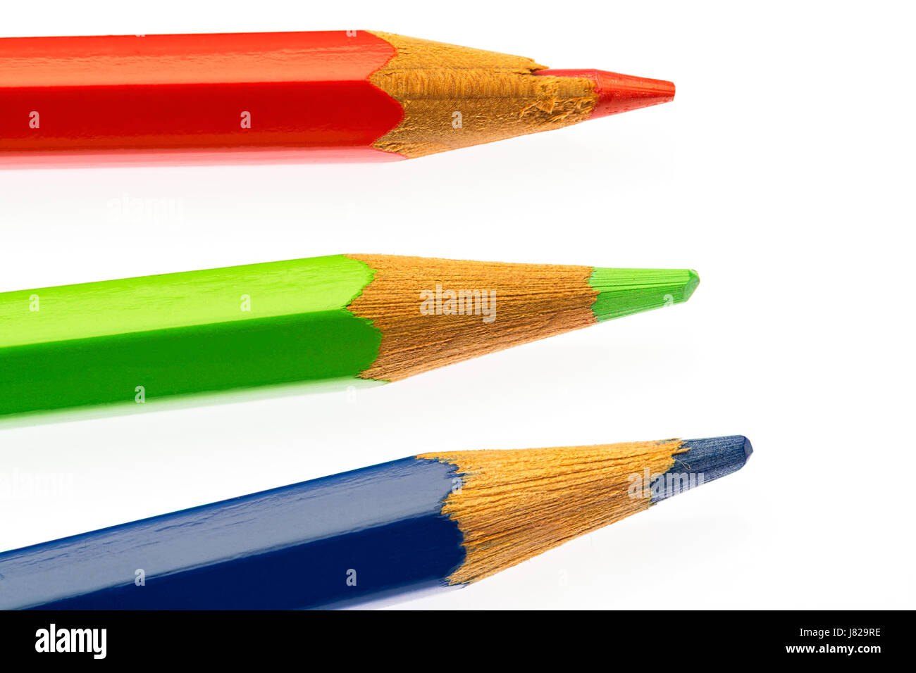 color pencils of different colors red green abd blue on white ...