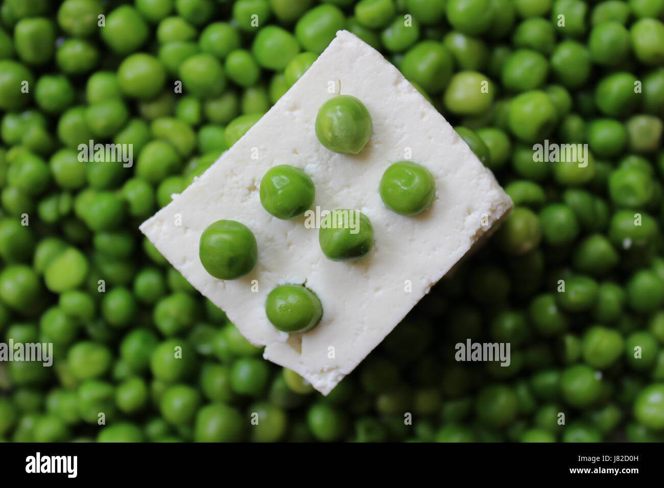 Green peas and cheese cube Stock Photo - Alamy