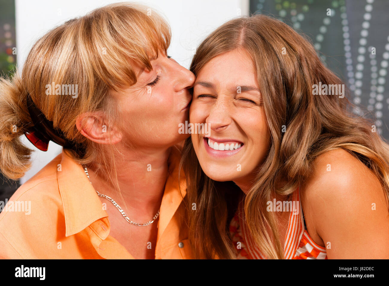 kisses in the family Stock Photo - Alamy