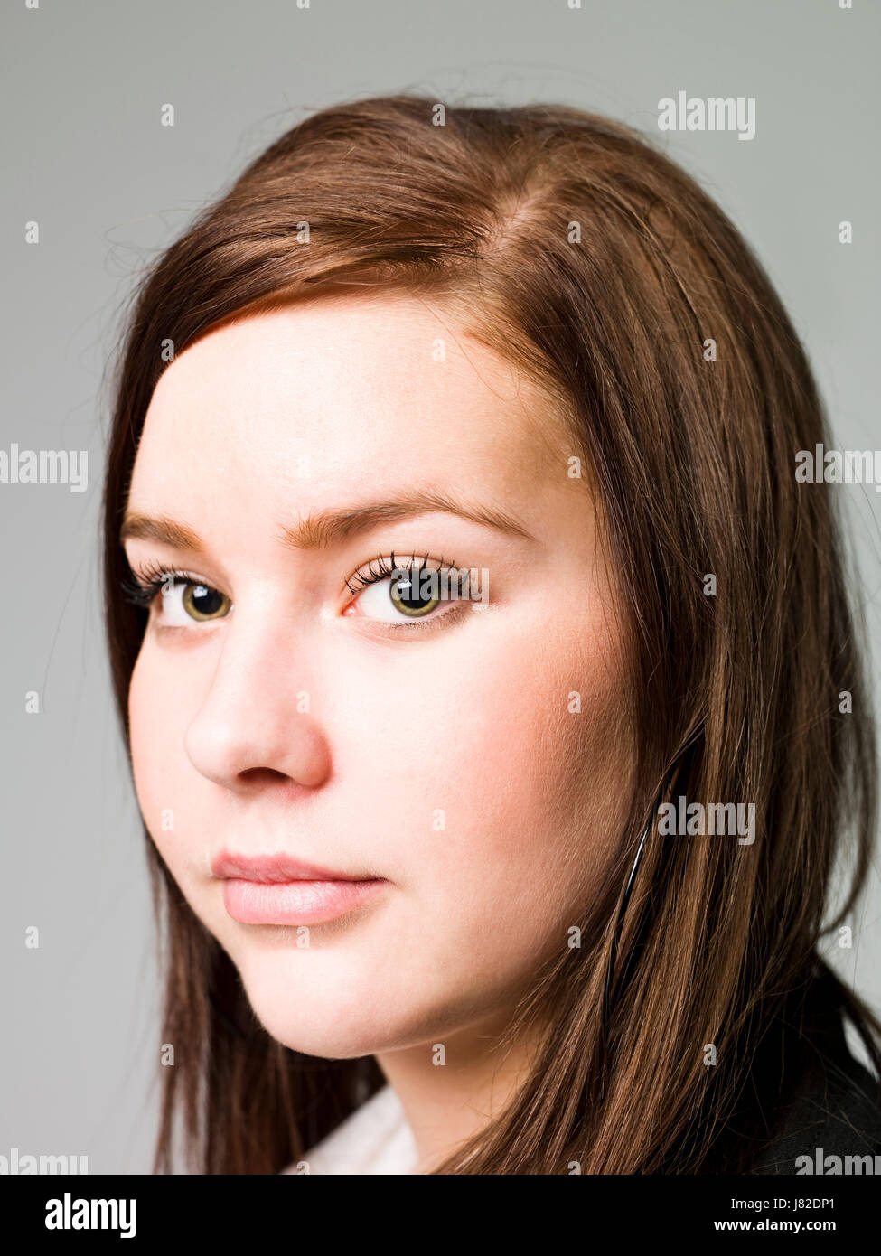 woman portrait skin eyes grave solemn serious young younger grey gray ...