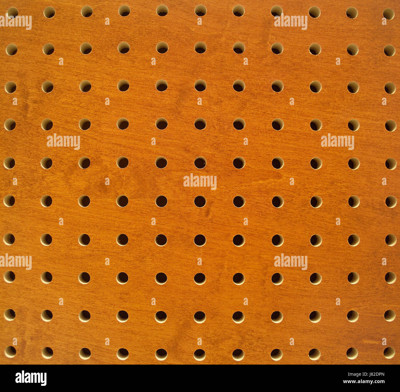 closeup industry wood hole pattern photo model model orange small holes ...