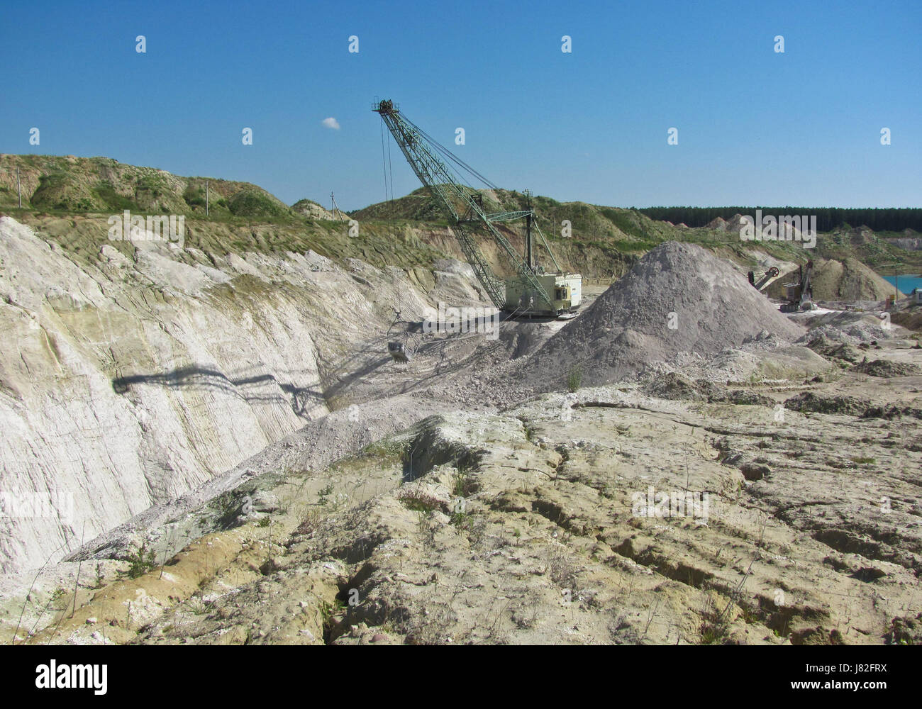 crawler excavator at work in a quarry Stock Photo - Alamy