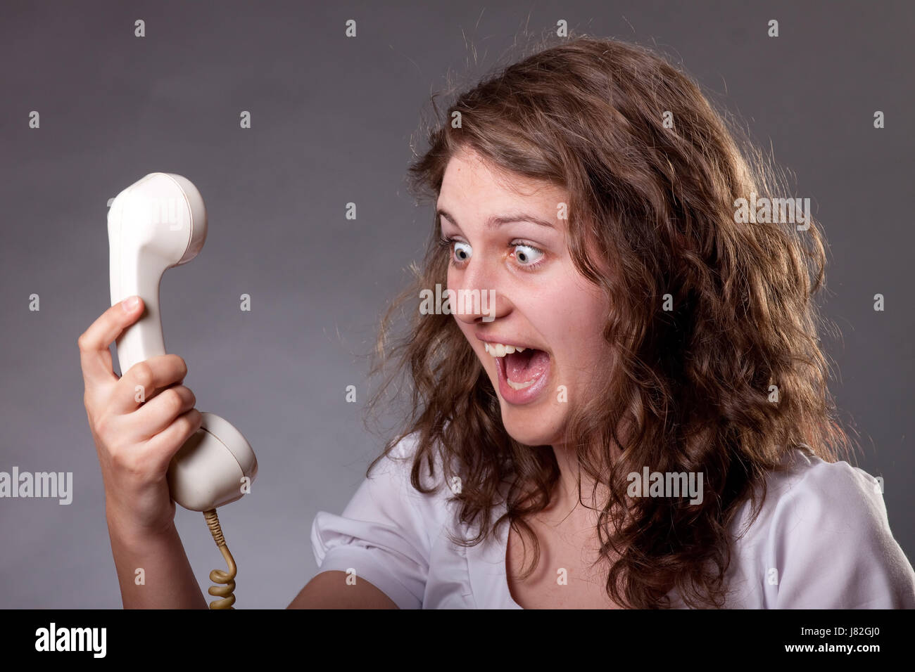 woman telephone phone communication raving furious angry irately old ...