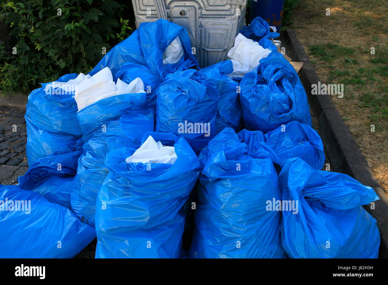 blue garbage bags in close Stock Photo - Alamy