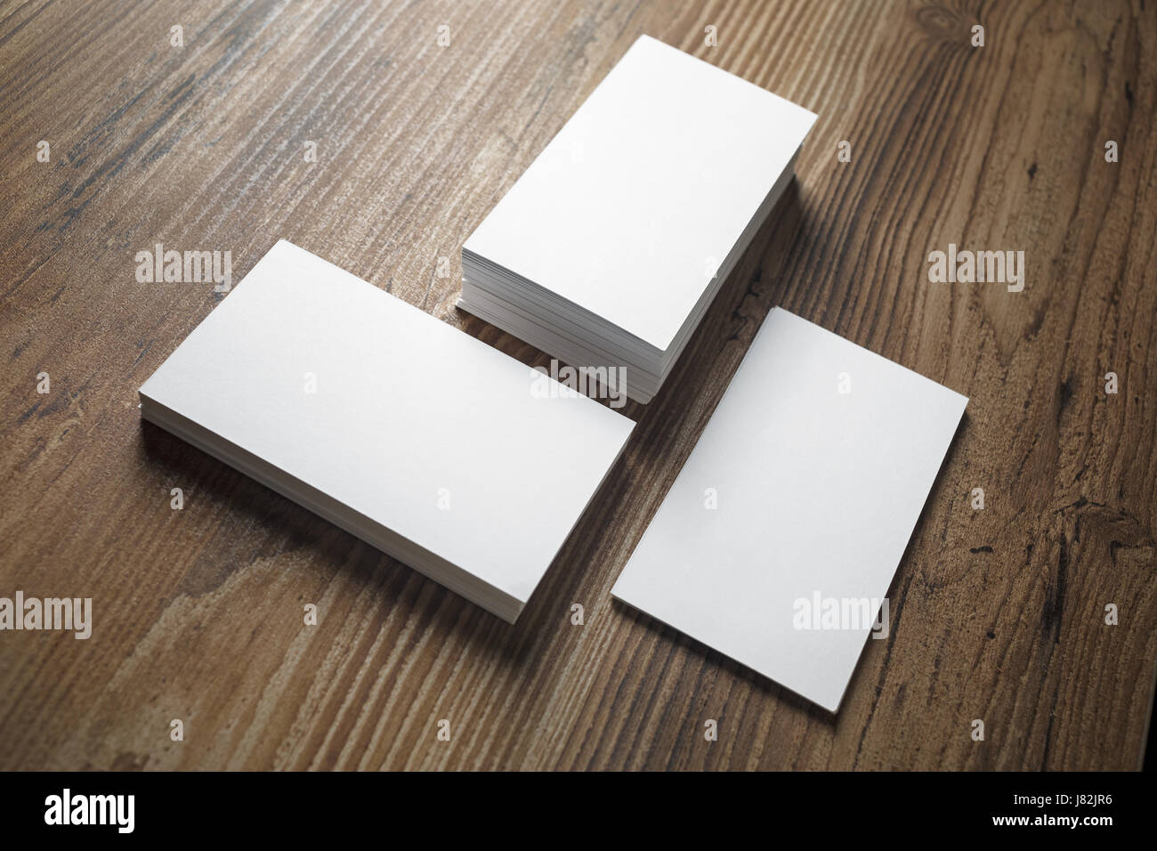 Photo of business cards on wooden office table background. Stacks of ...