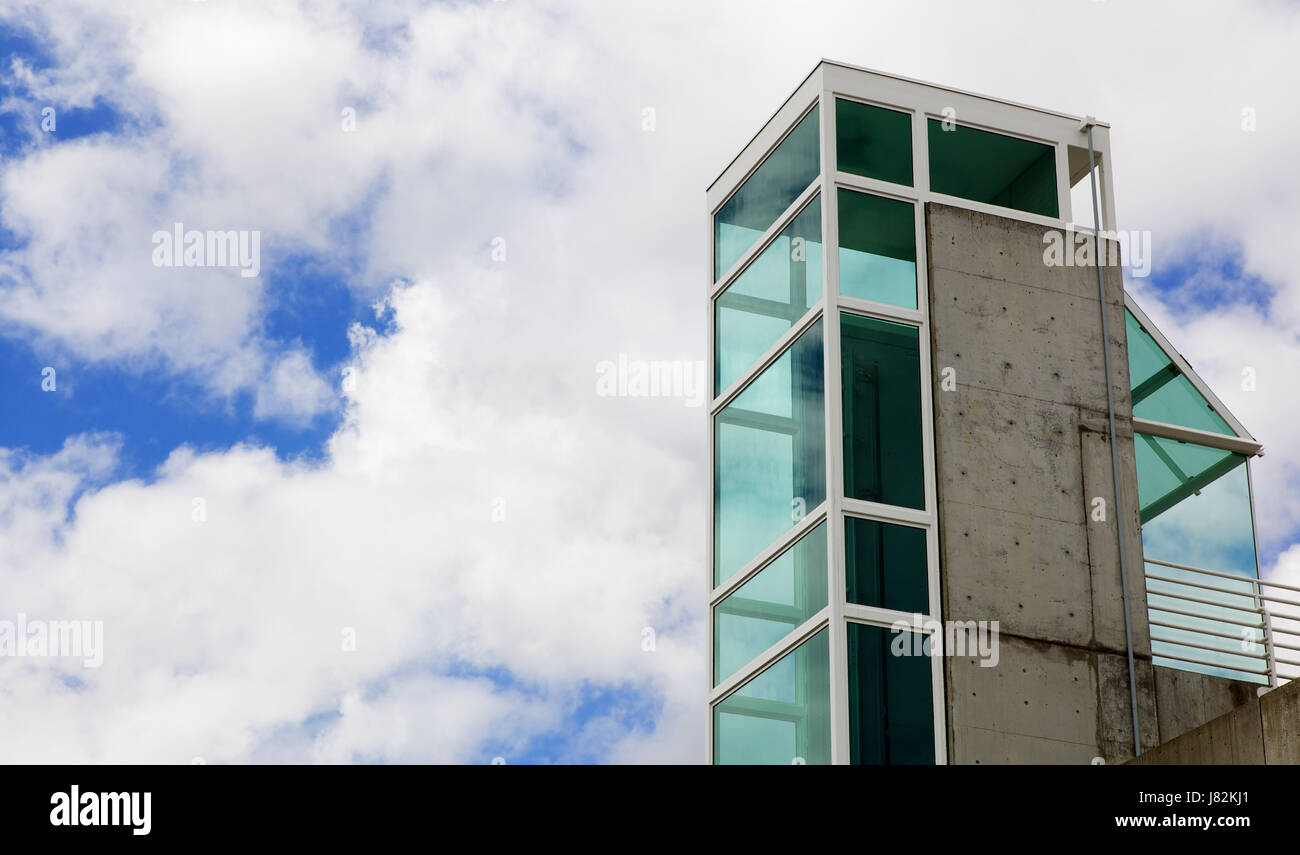 blue tower glass chalice tumbler elevator lift green concrete railing ...