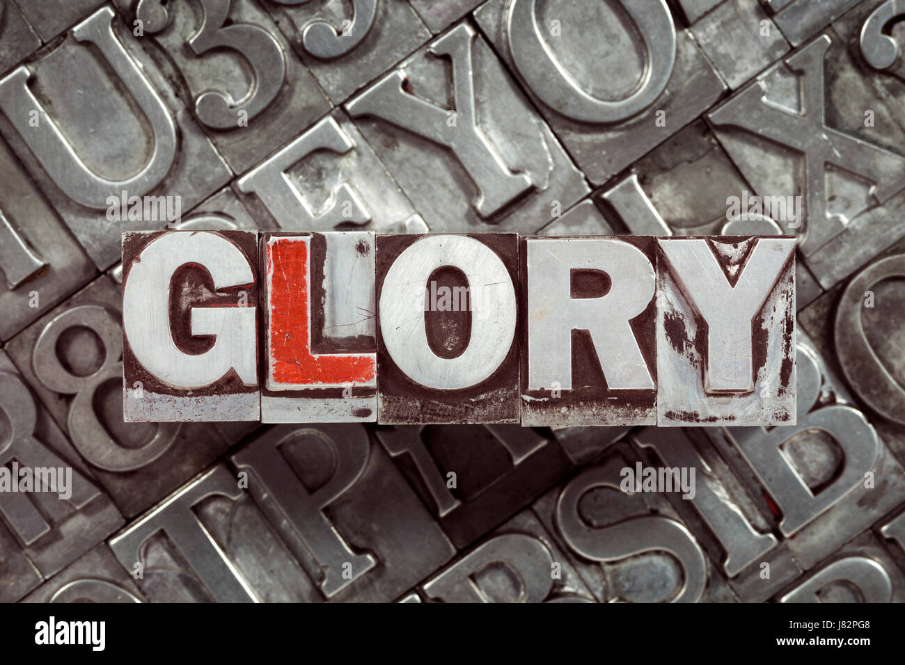 glory word concept made from metallic letterpress blocks on many ...