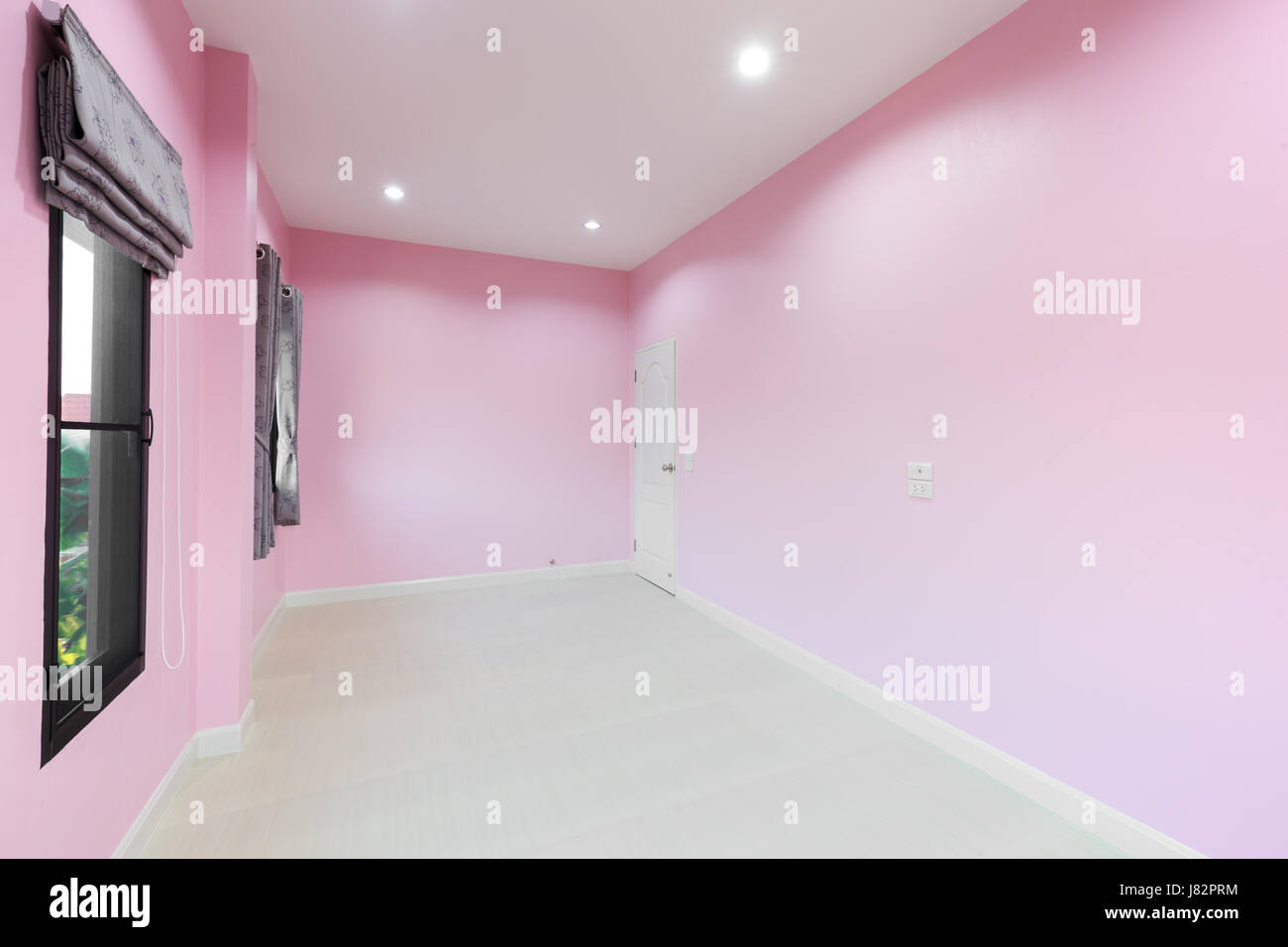 empty pink room with door and window in home Stock Photo - Alamy