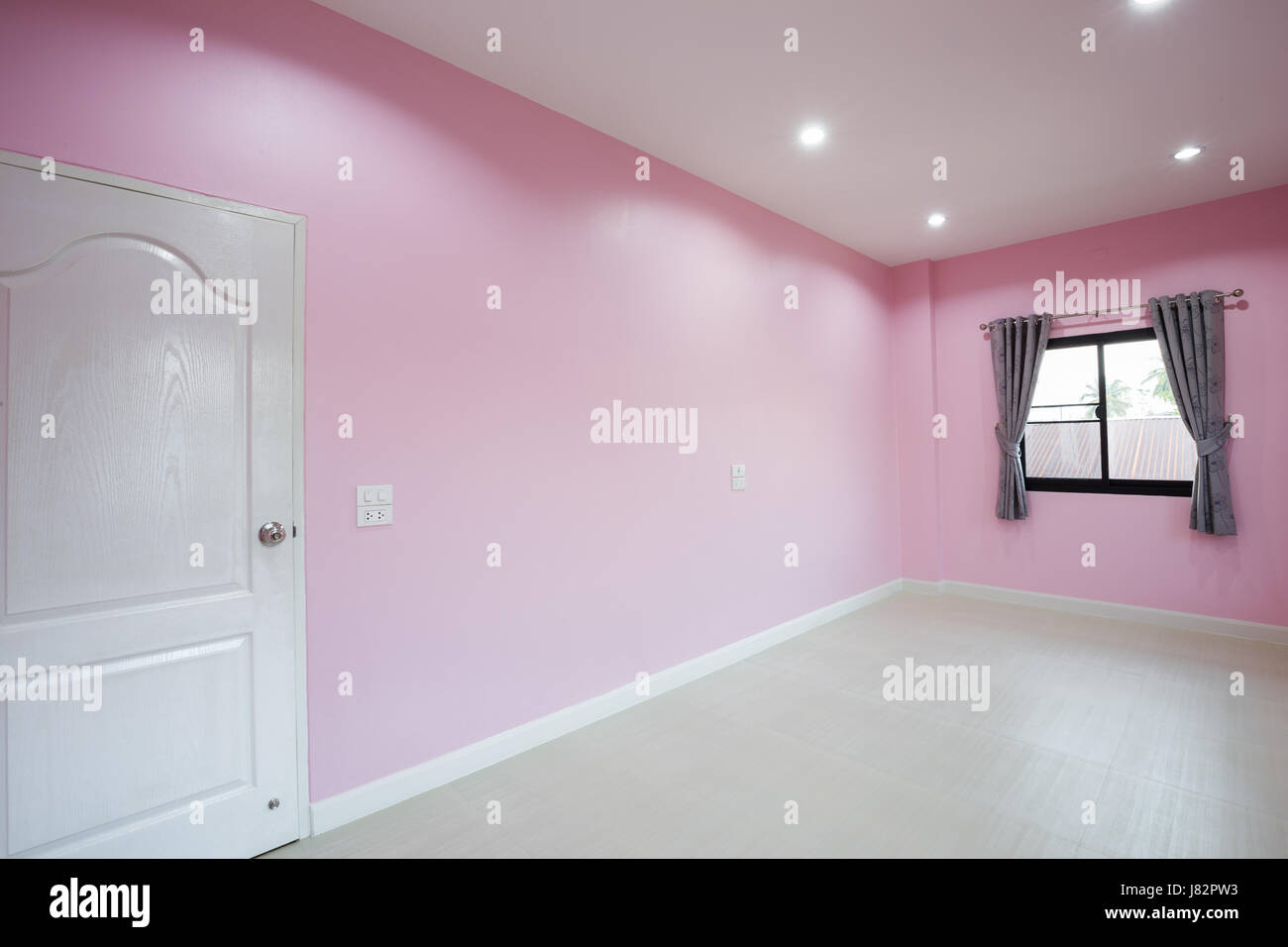 empty pink room with door and window in home Stock Photo - Alamy