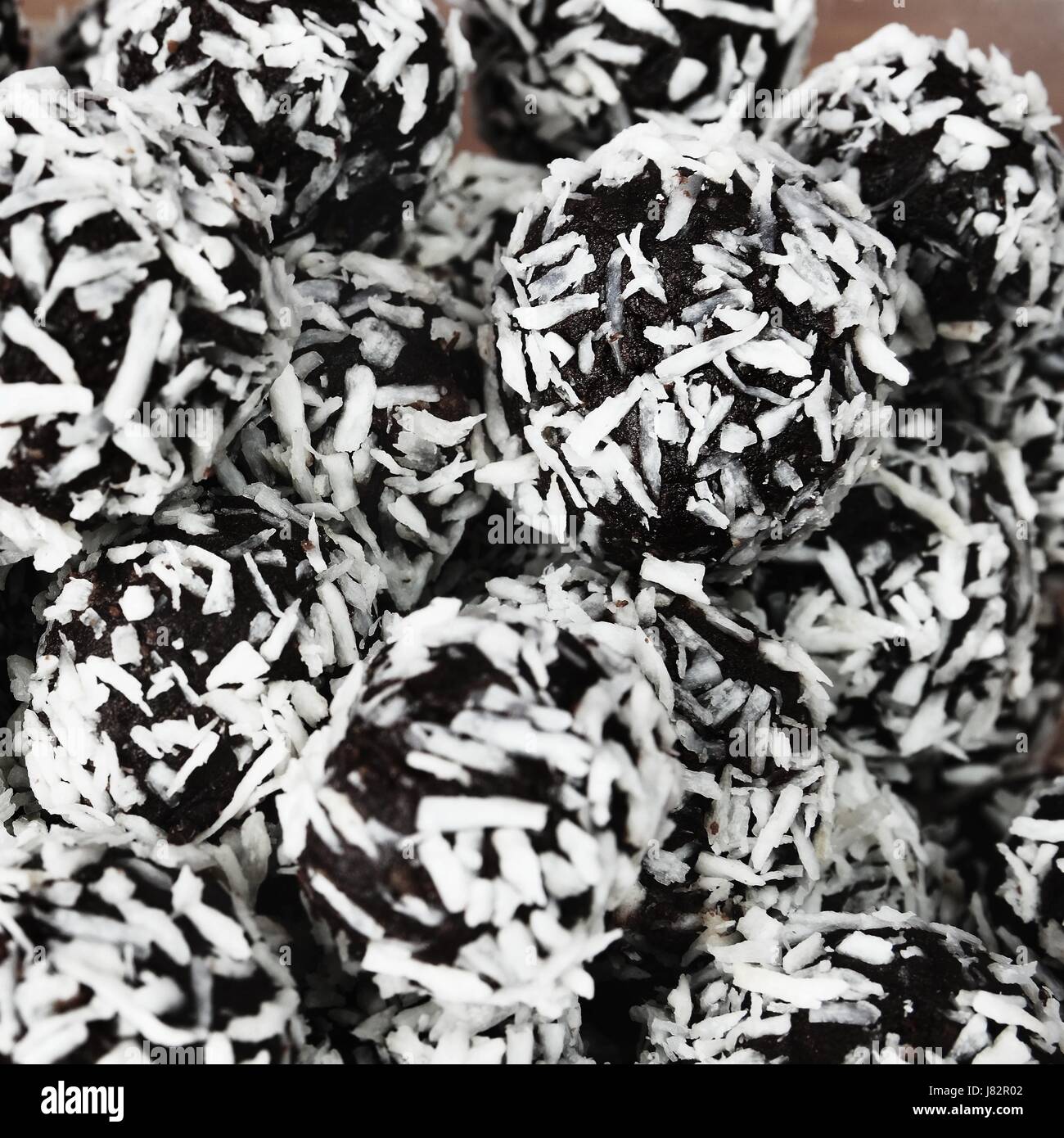 Christmas sweets on a plate - Rum balls in coconut. Traditional ...