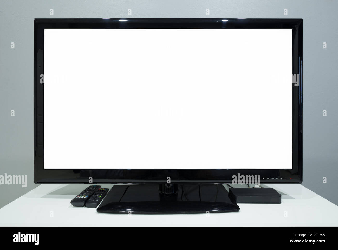 LED TV with blank screen on white stand Stock Photo - Alamy