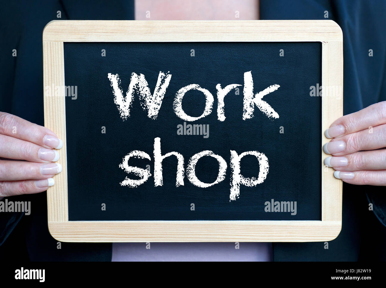 workshop - woman with chalkboard Stock Photo - Alamy