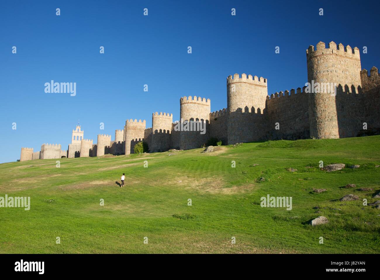 monument stone spain wall fortification castle landmark chateau woman ...