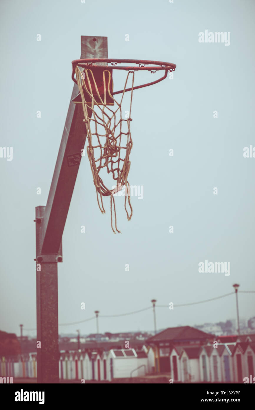 Seaside playground basketball hoop with a ripped net at Preston Green ...